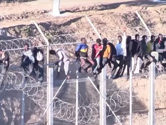 Migrants Injured after Becoming Trapped Atop Spanish Border Fence - MTV ...