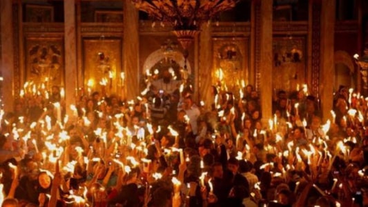 The Holy Fire ignites from the tomb of Jesus Christ at the Church of ...