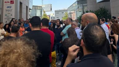 Touch, Alfa employees rally outside both companies’ headquarters to ...