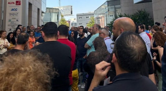 Touch, Alfa employees rally outside both companies’ headquarters to ...